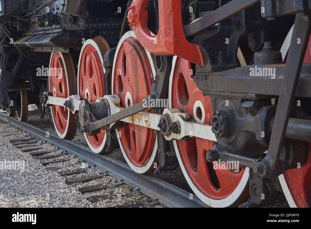 Steel wheels of a Soviet retro steam locomotive on rails Stock Photo ...