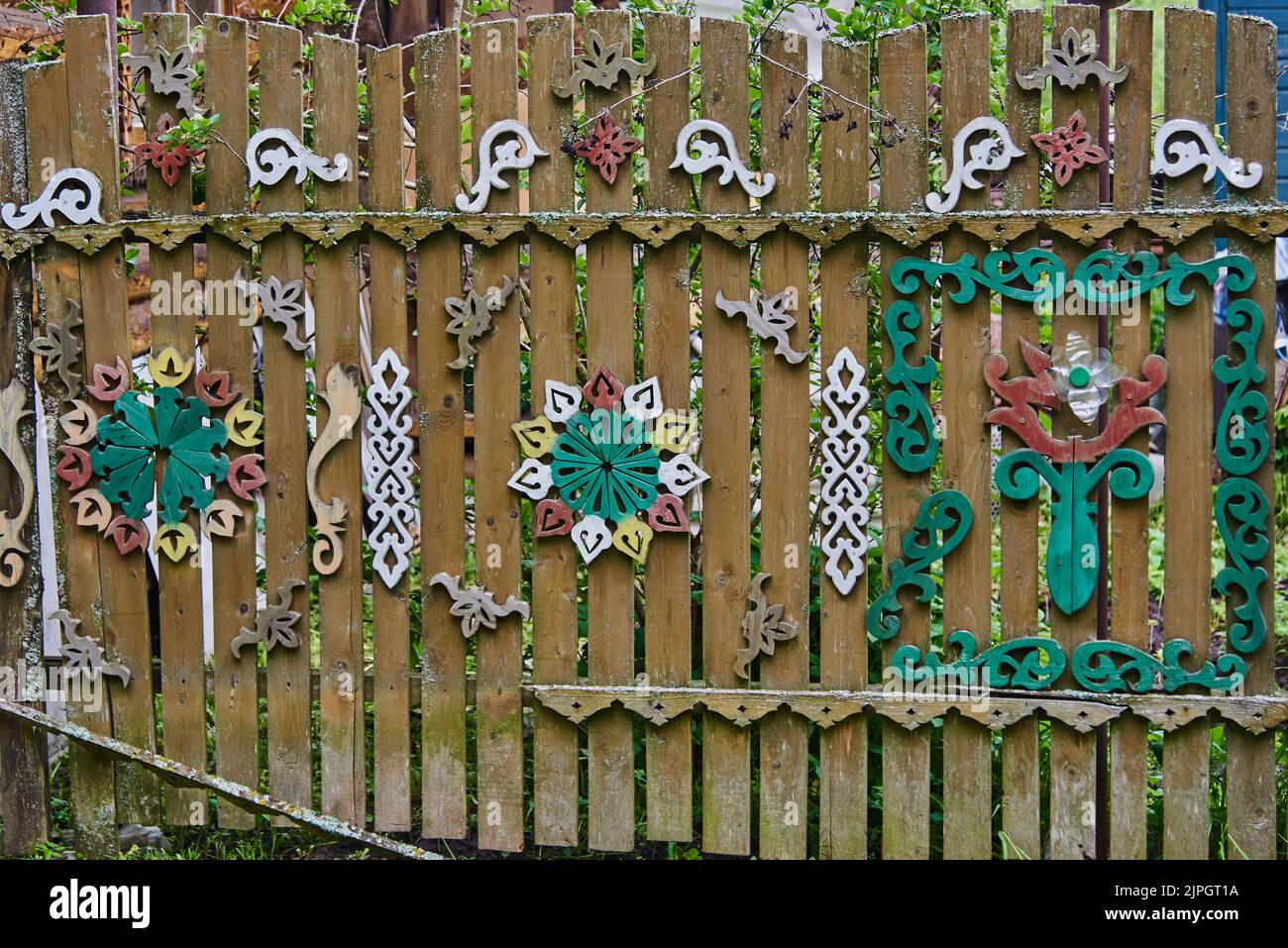 A fragment of a wooden fence decorated with elaborate carvings Stock ...