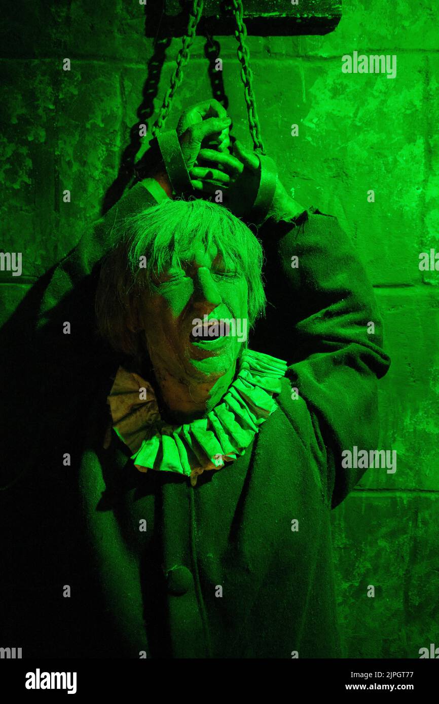A Woman Chained In A Prison Cell With Colorful Lighting Effect At The Clink Prison Museum