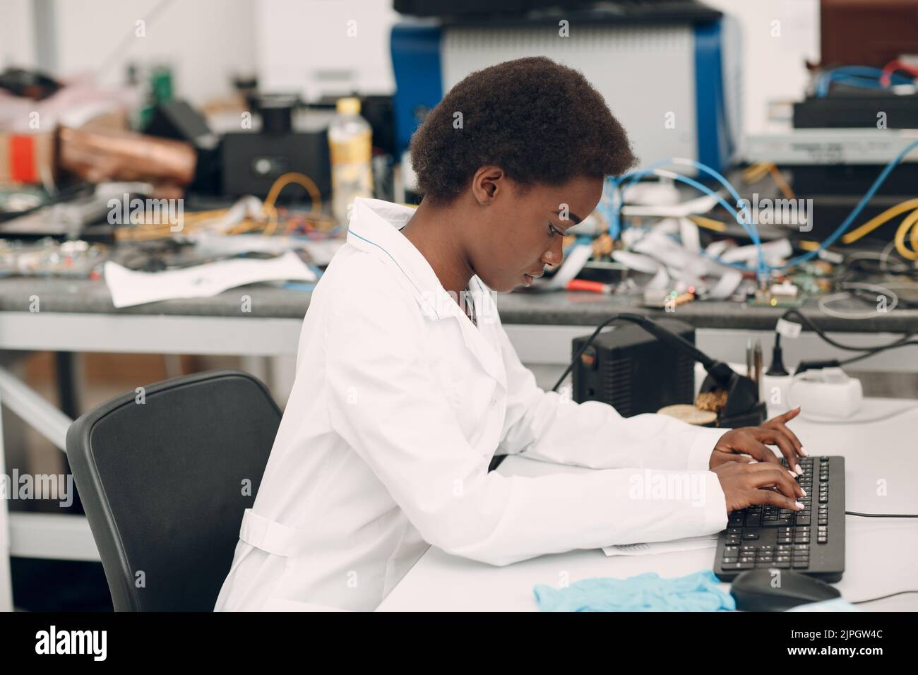 Scientist african american woman working in laboratory with computer ...
