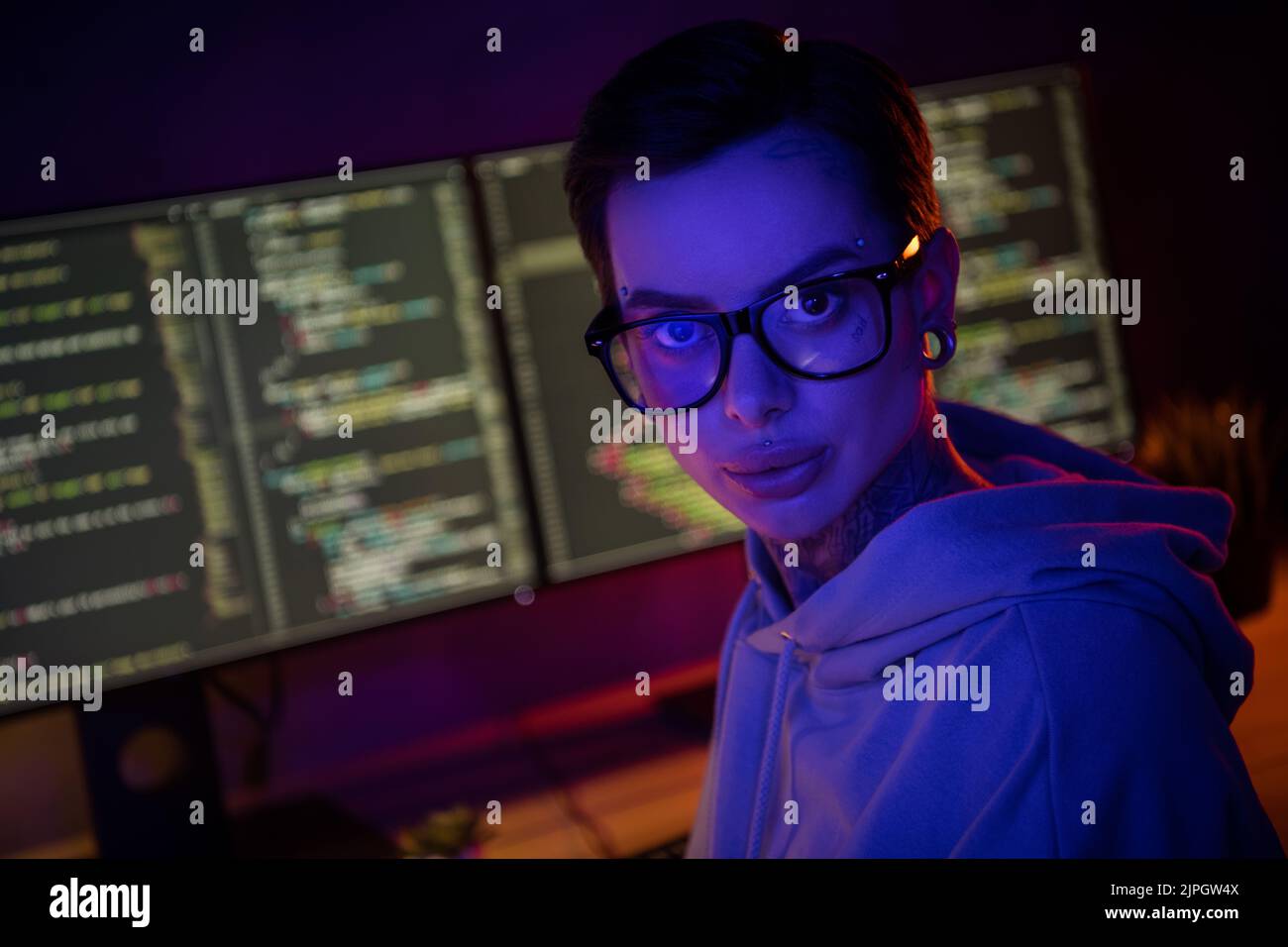 Photo of serious hipster programmer girl operating database security ...