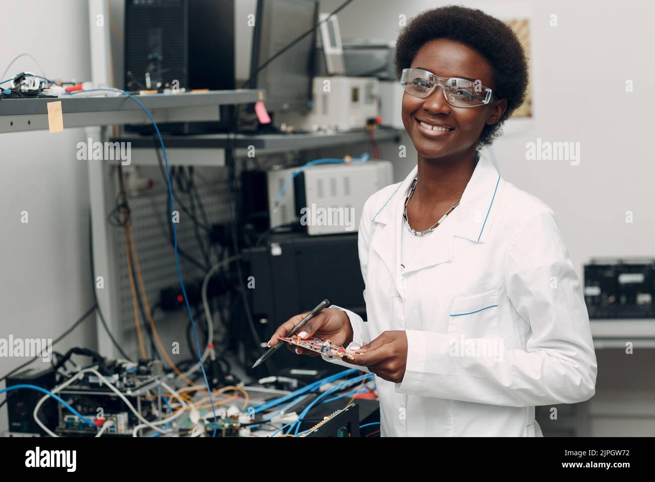 Scientist african american woman working in laboratory with electronic ...