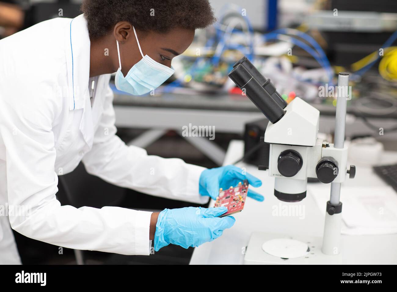 Scientist african american woman working in laboratory with electronic ...