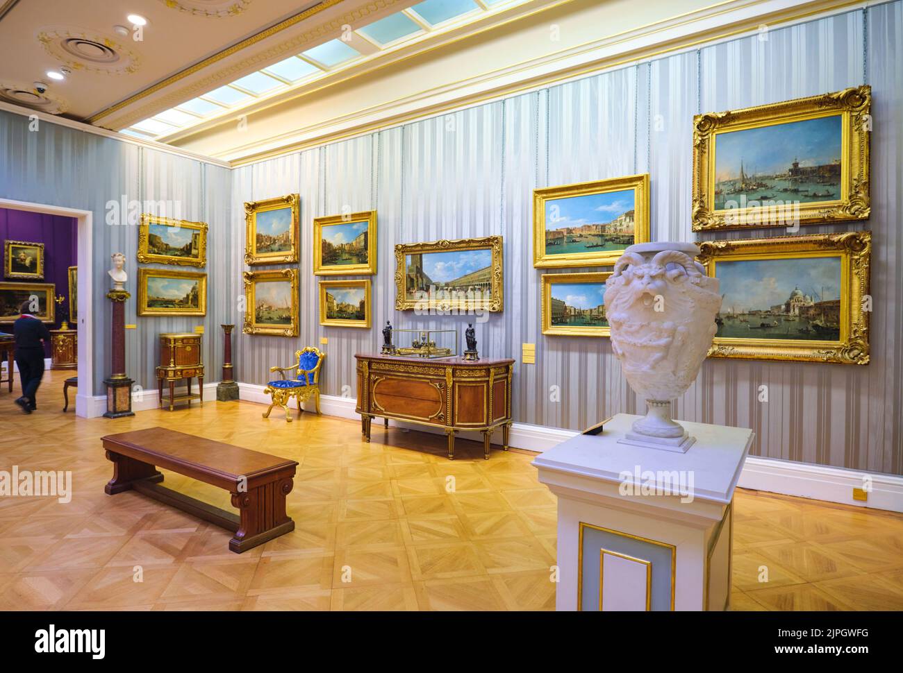 A room with a collection of paintings of Venice by the Italian artist ...