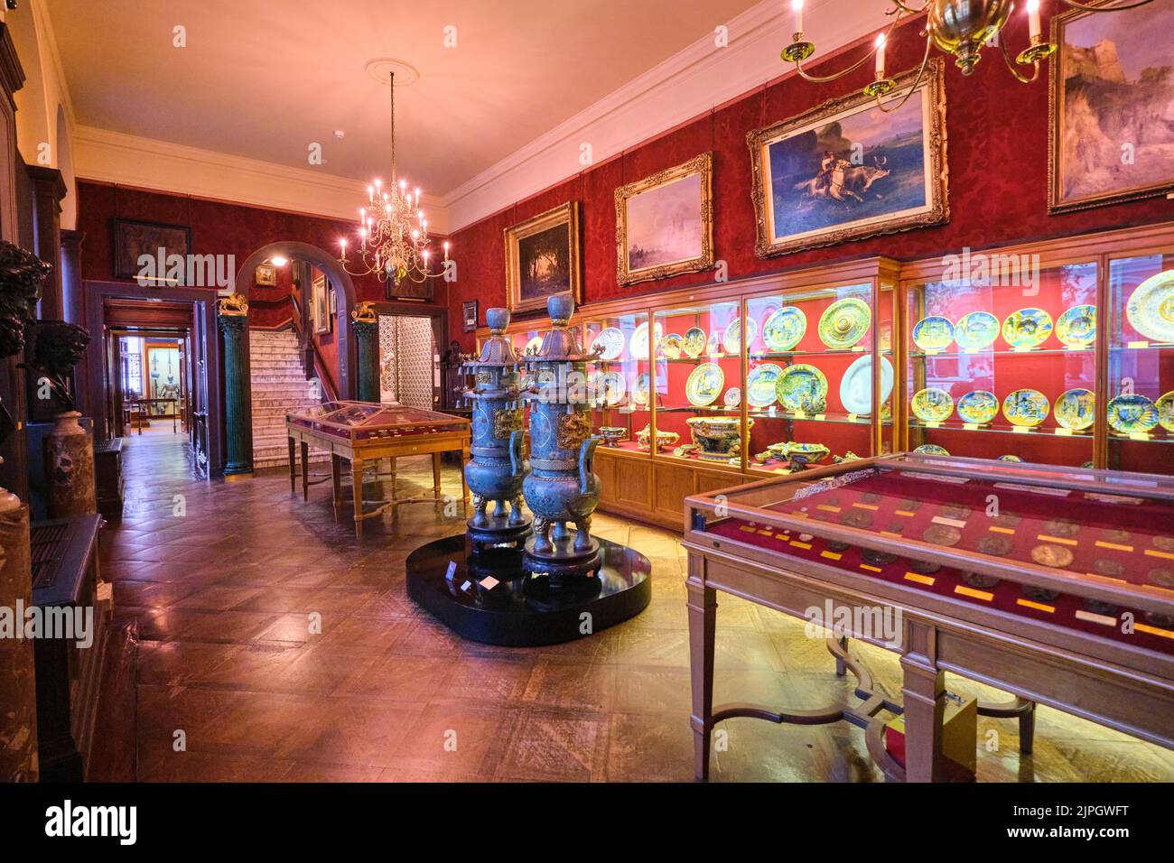 A room with large collections of medalions and plates. At the Wallace ...