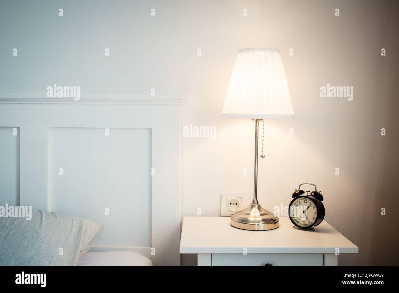 vintage alarm clock in bright bedroom Stock Photo - Alamy