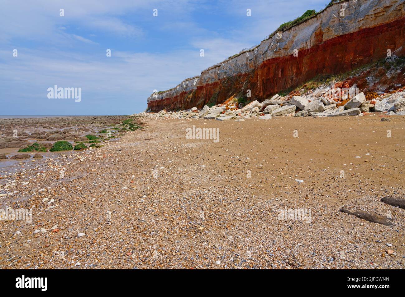 Rock falls along the beach from the eroding cliffs of Hunstanton on the ...