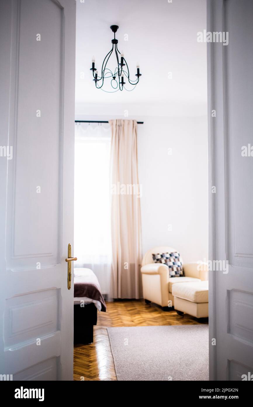 vintage white door opening into bedroom Stock Photo - Alamy