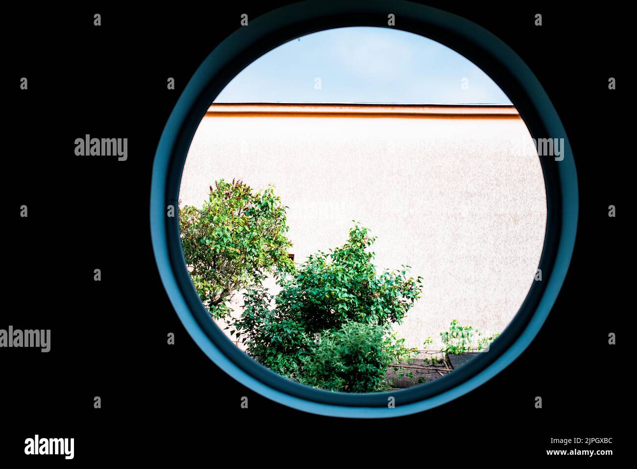 round window tree and house Stock Photo - Alamy