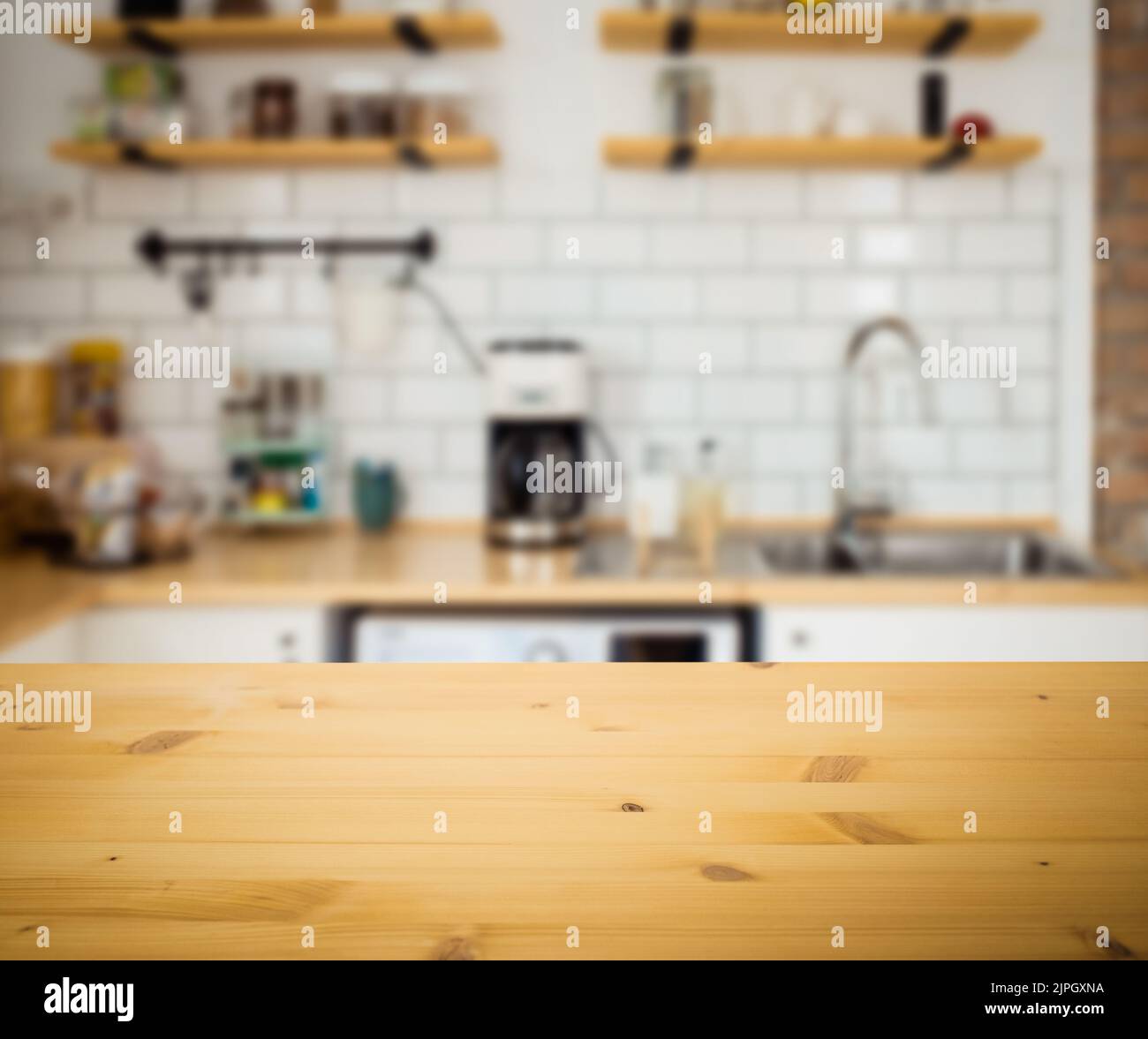 empty wooden tabletop and blurred kitchen mock up for product display ...