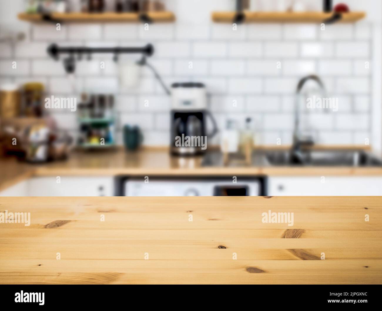 empty wooden tabletop and blurred kitchen mock up for product display ...