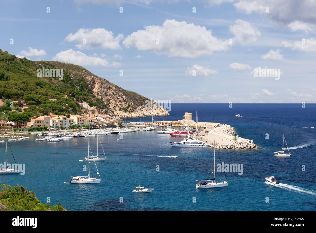 Marciana Marina boat pier with its sixteenth-century watchtower Torre ...