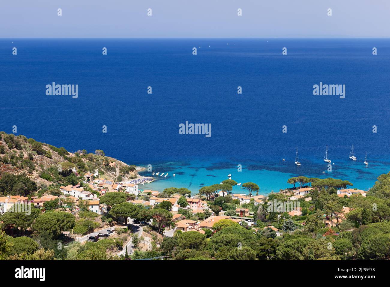 Small coastal village with a small beach, a marina, and the endless ...