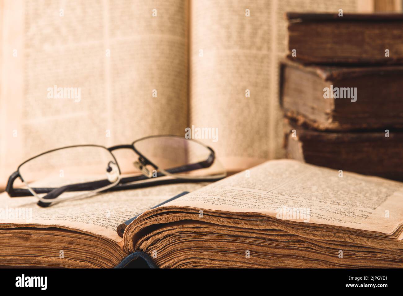 Shabby pages of worn old jewish books in leather binding. Reading Torah ...