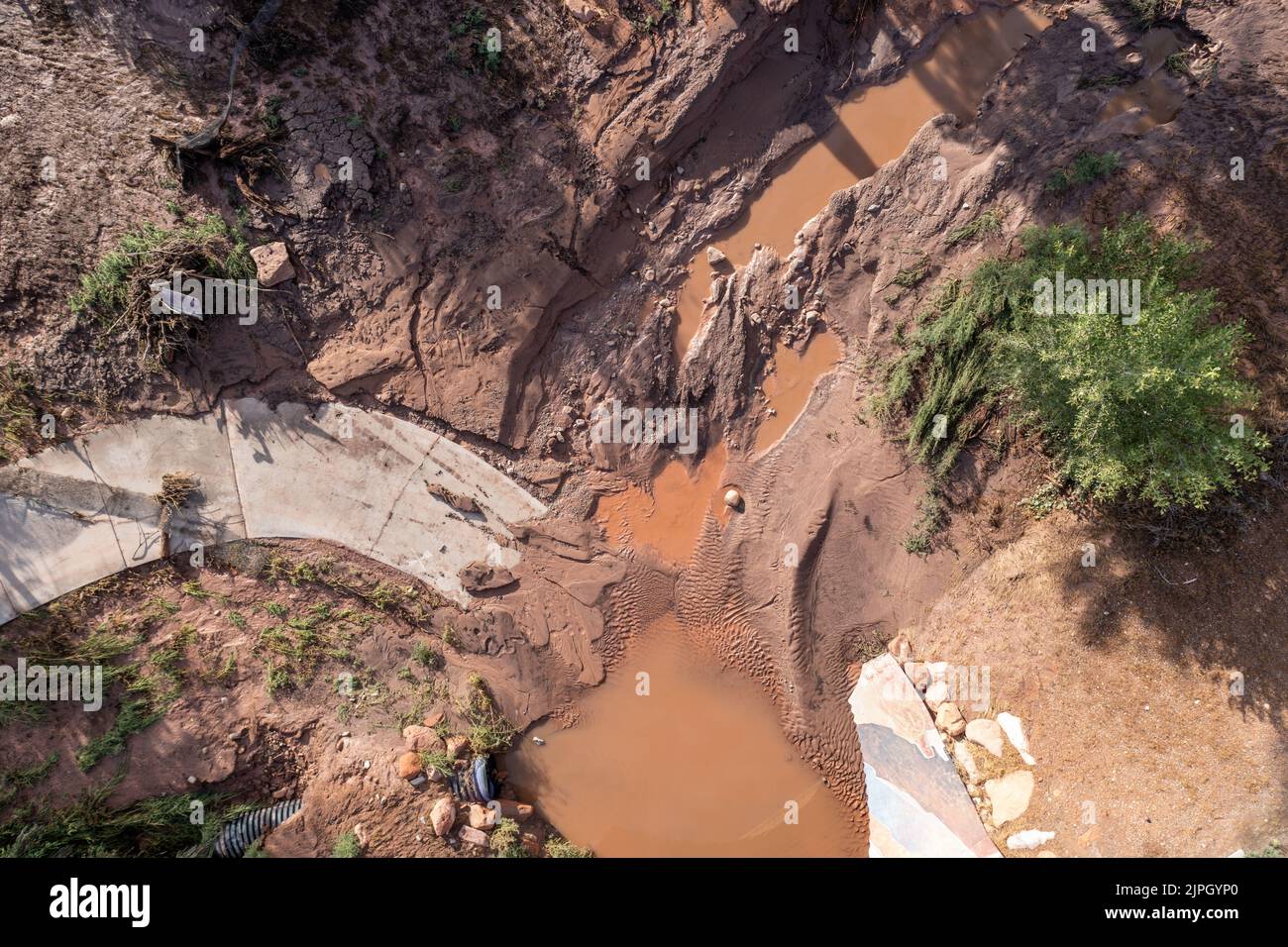 Severe erosion damage caused by flash flooding after vegetation loss ...
