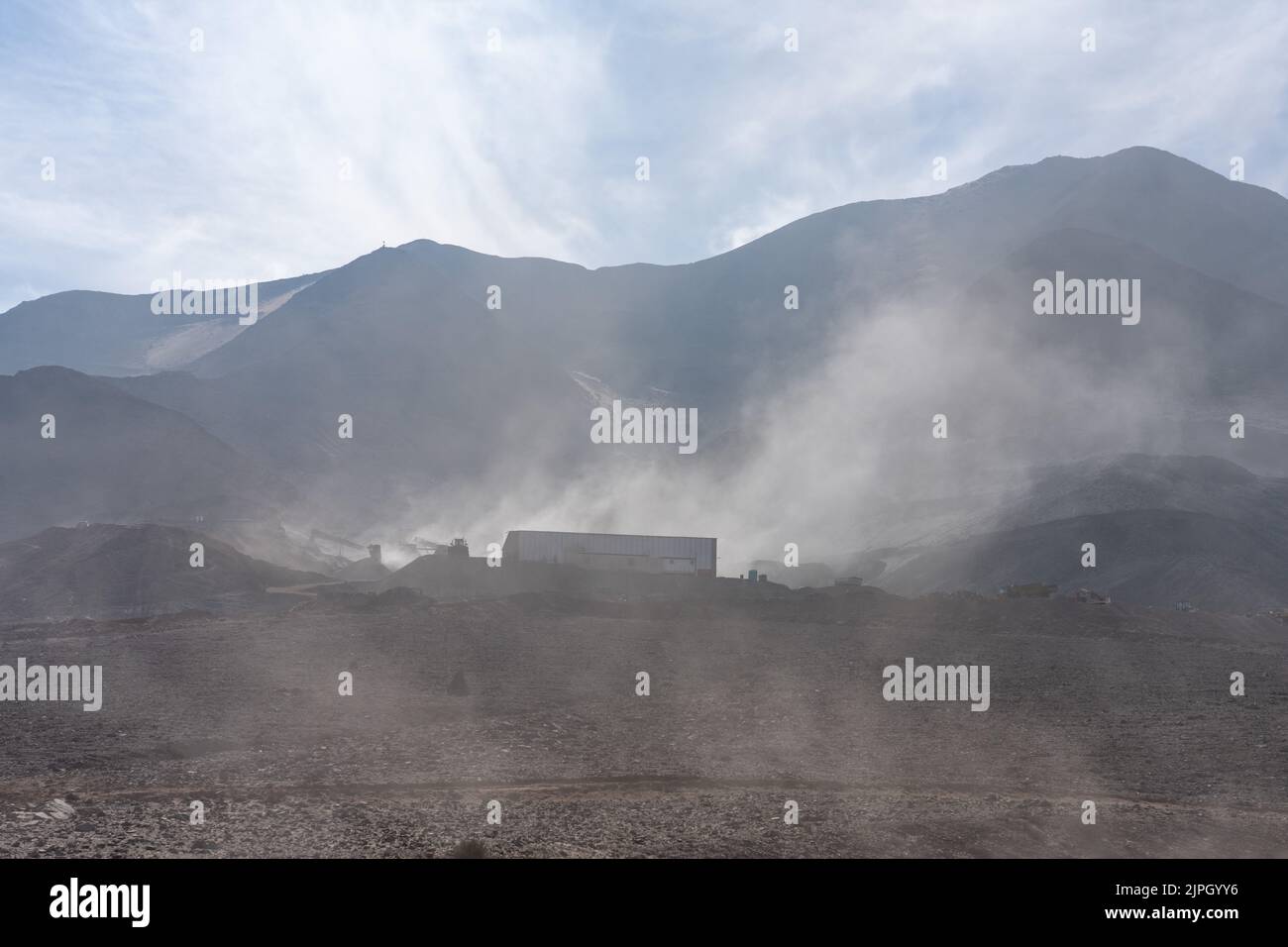 Dust filling the air at an open pit mine site near Copiapo in the ...