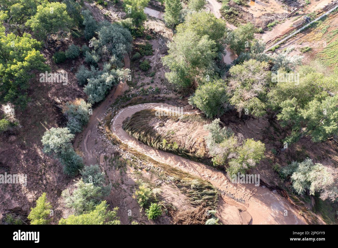 Severe erosion damage caused by flash flooding after vegetation loss ...