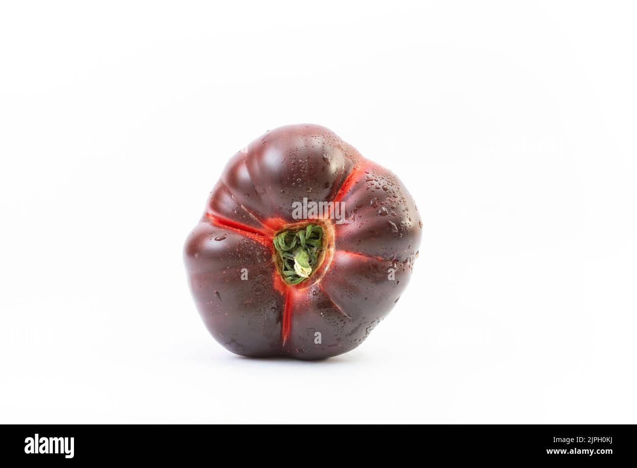 black tomato isolated on white background Stock Photo - Alamy
