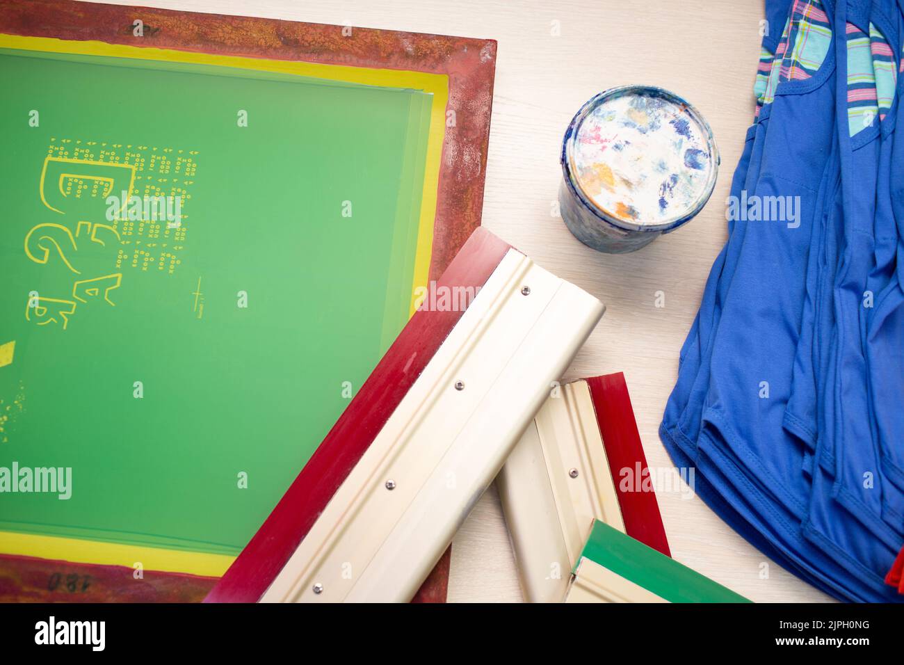 Serigraphy silk screen print process at clothes factory. Frame template ...