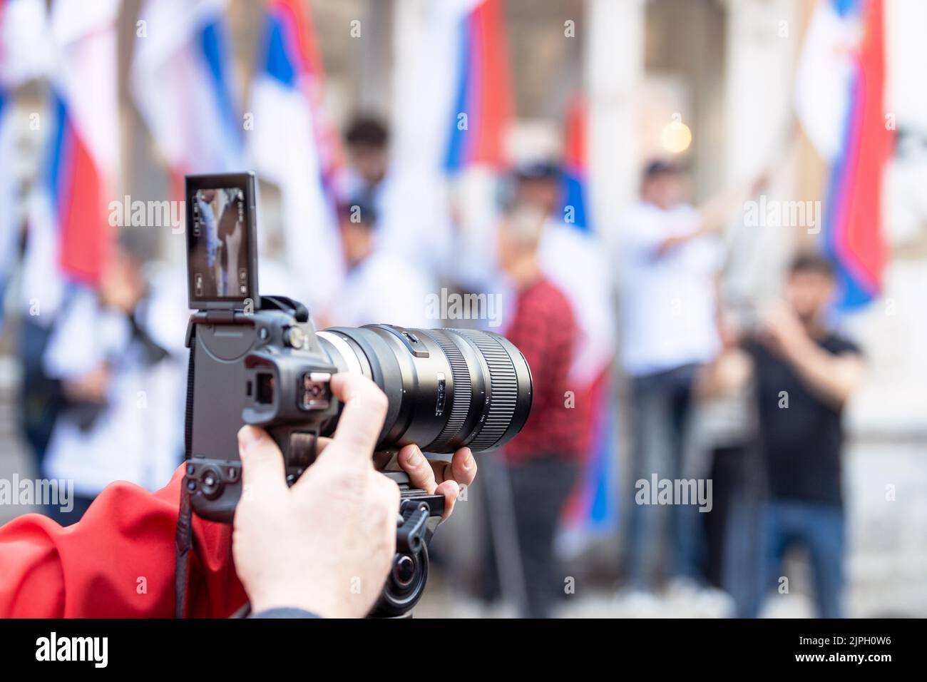 Filming crowd of people with a digital video camera Stock Photo - Alamy