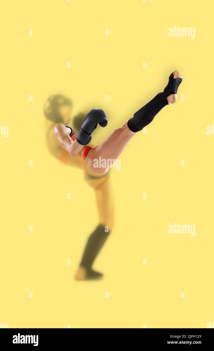 Blurring effect. Portrait of young female kickboxer in sports uniform ...