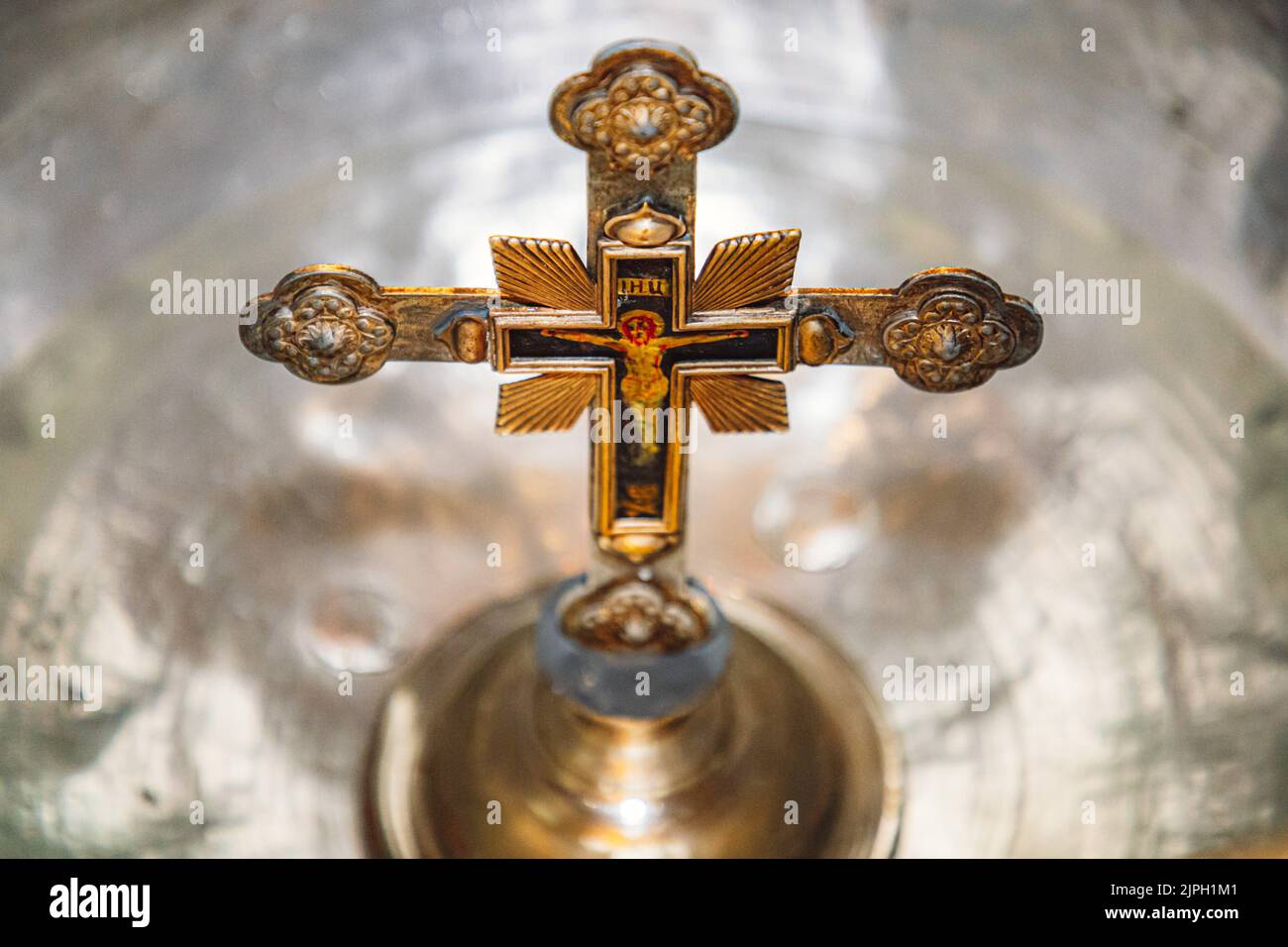a cross in a box in a church during baptism Stock Photo - Alamy
