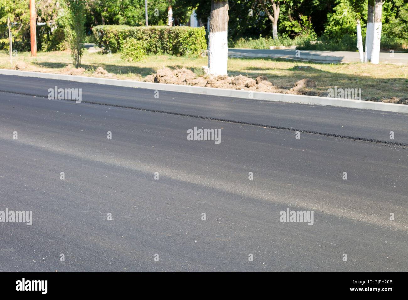 An empty wide street of city with new asphalt Stock Photo - Alamy