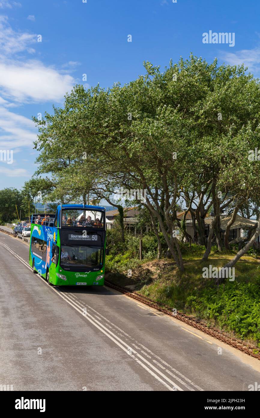 Purbeck Breezer 50 open top bus travelling along Ferry Road, Studland ...