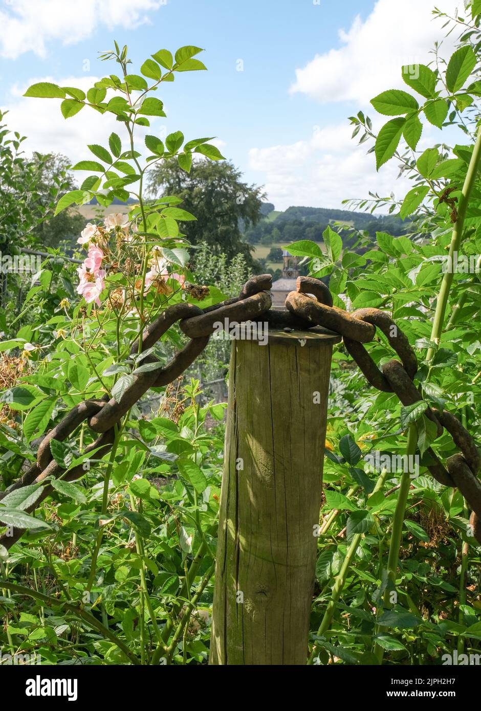 A huge iron chain dangling from a wooden post in Chatsworth House ...