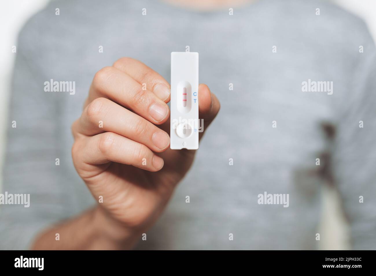 A positive rapid home based coronavirus test showing infection Stock ...