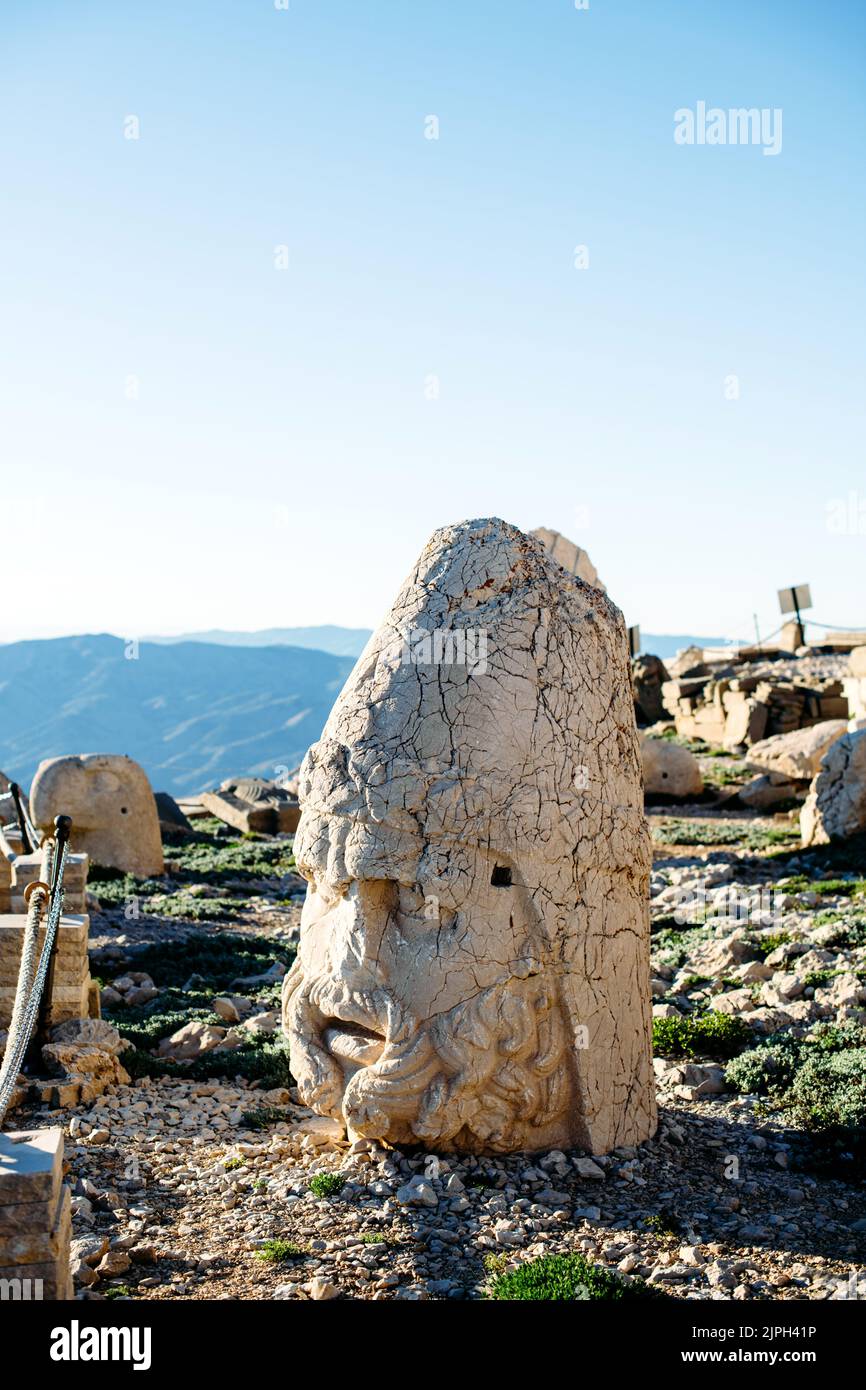 Heads of the statues on Nemrut Dag on the sunset. Travel concept photo ...