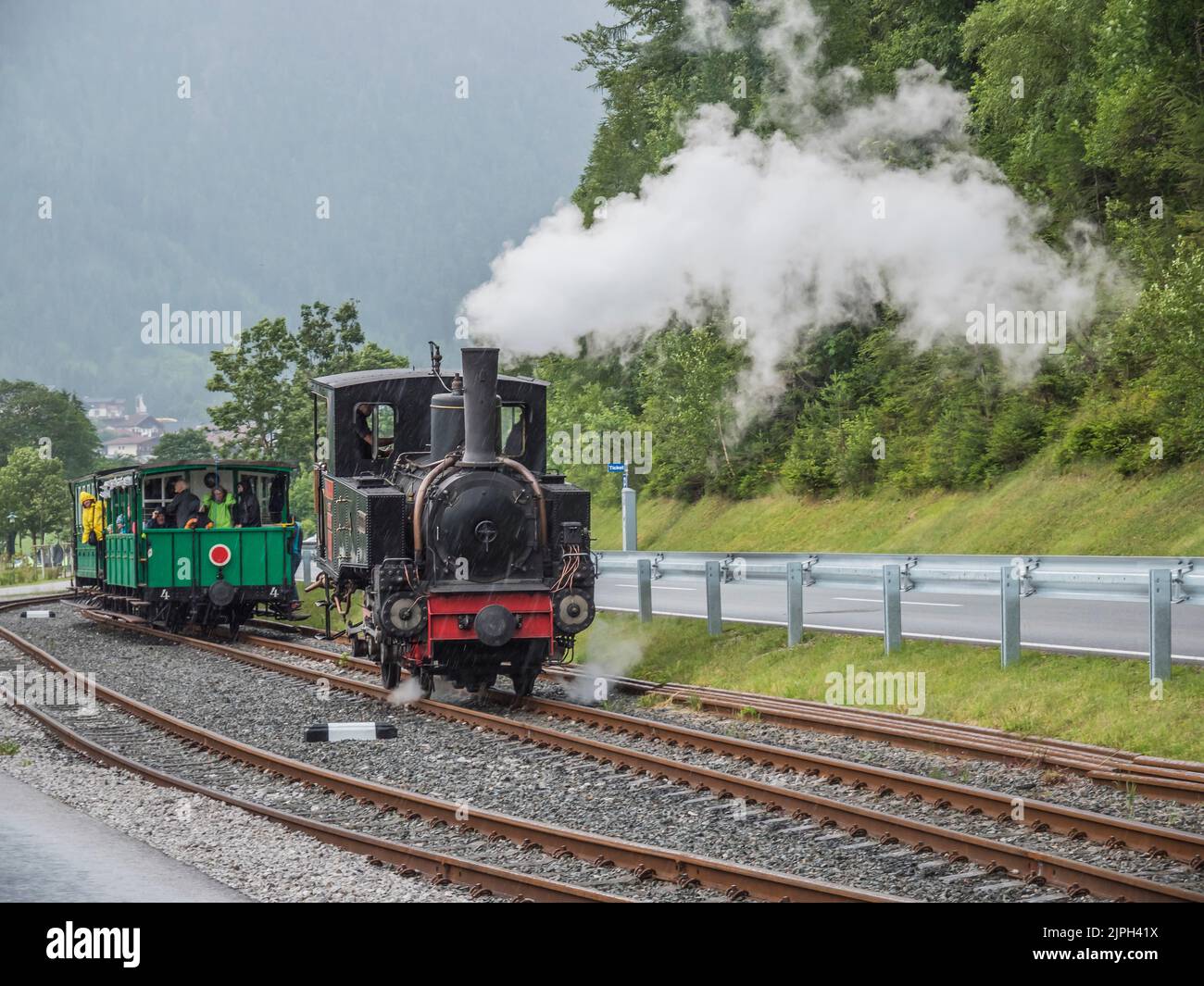 This is the famous cog railway steam train with its vintage carriages ...