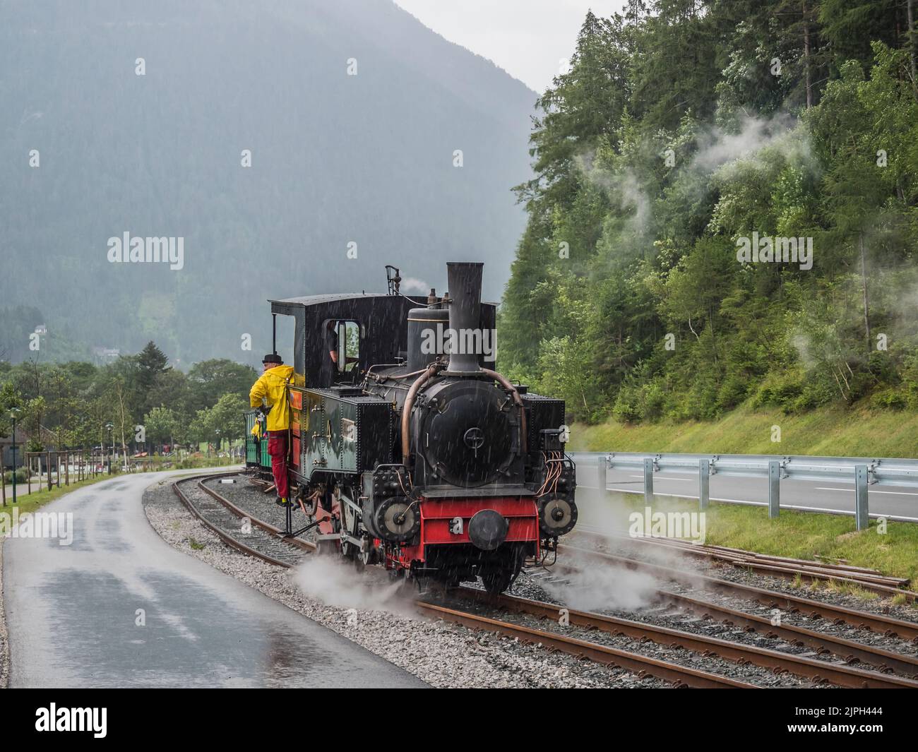 This is the famous cog railway steam train with its vintage carriages ...