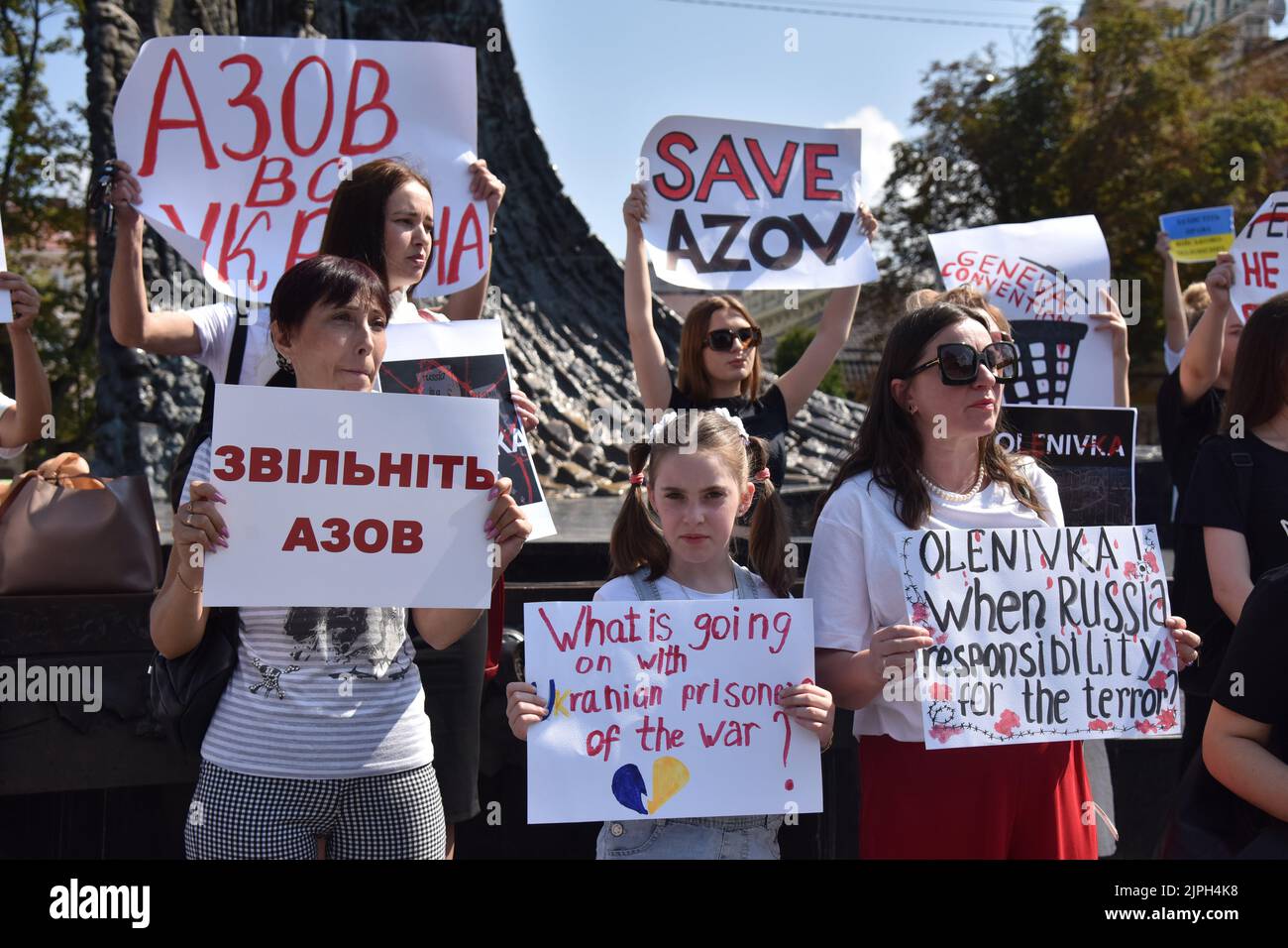 Protesters hold placards calling for the release of captured soldiers ...
