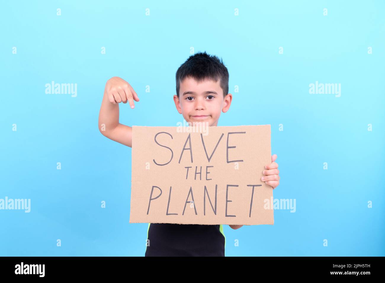 child with poster to save the planet. children against pollution ...