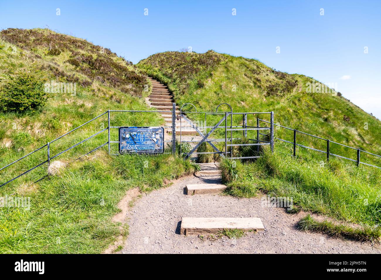 A path leading through a gate and up stairs to a viewpoint at Cave Hill ...