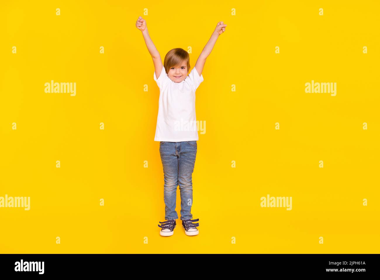 Full length body size view of handsome cheerful lucky pre-teen boy ...