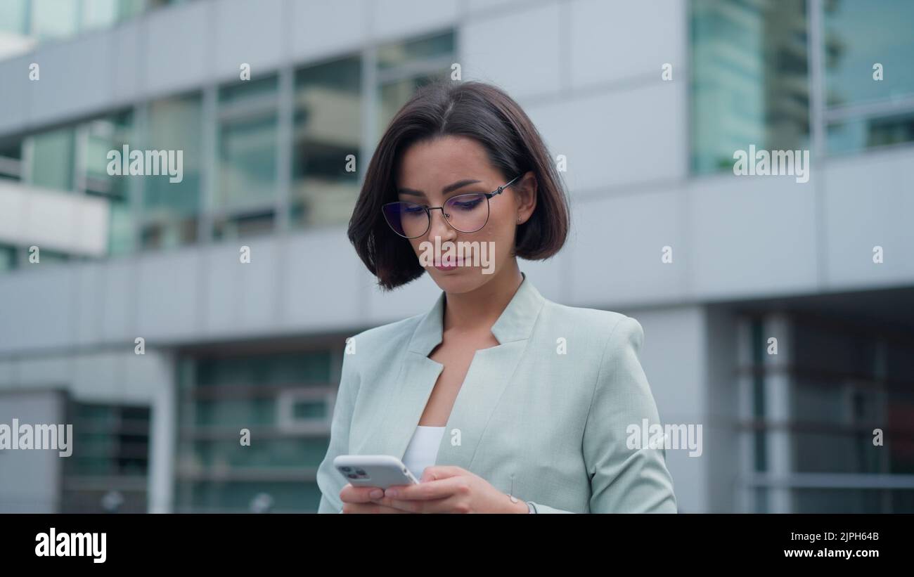 Portrait of independent proud woman with smartphone in her hands ...