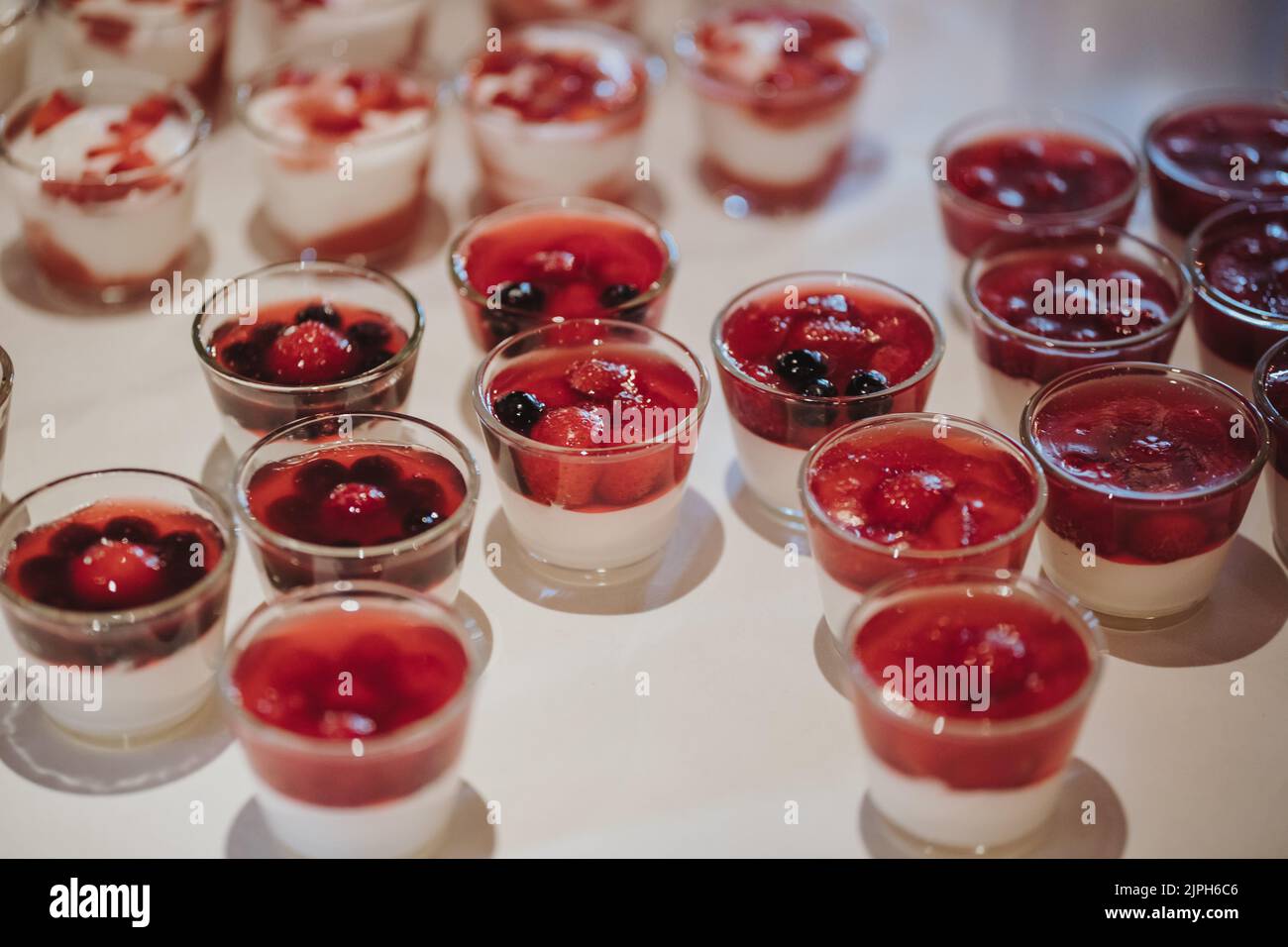 A variety of berry jellies in small glasses on the table Stock Photo ...