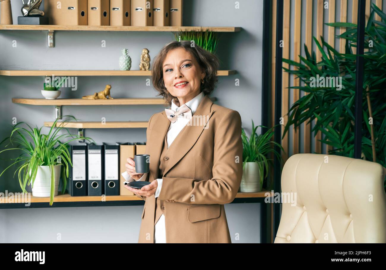 Confident stylish mature middle aged elderly woman in office. General ...