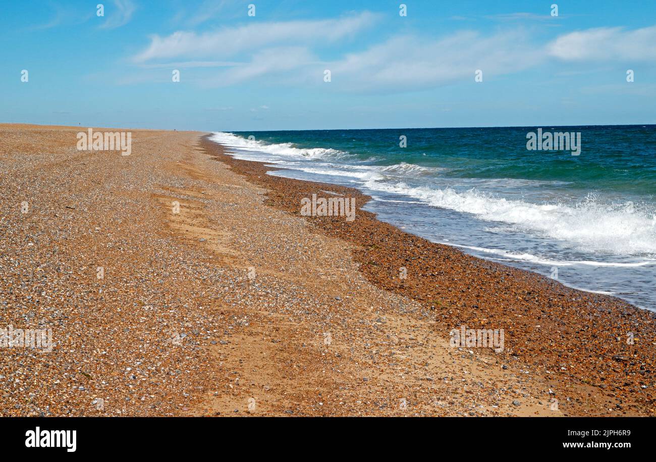 A view of the shingle beach and sea in summer on the North Norfolk ...