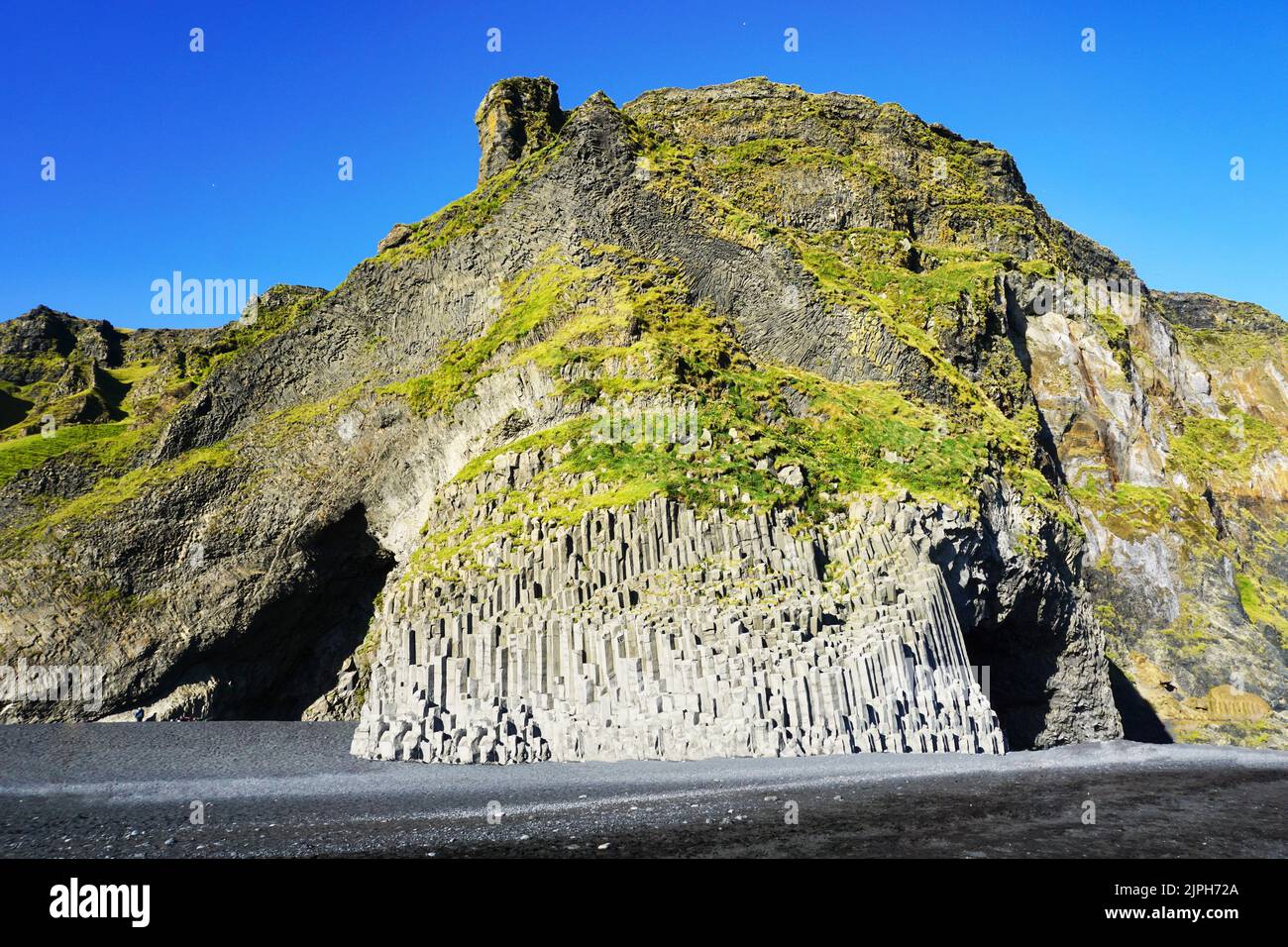 Basalt rocks and cave at Reynisfjara Black Beach in Iceland Stock Photo ...