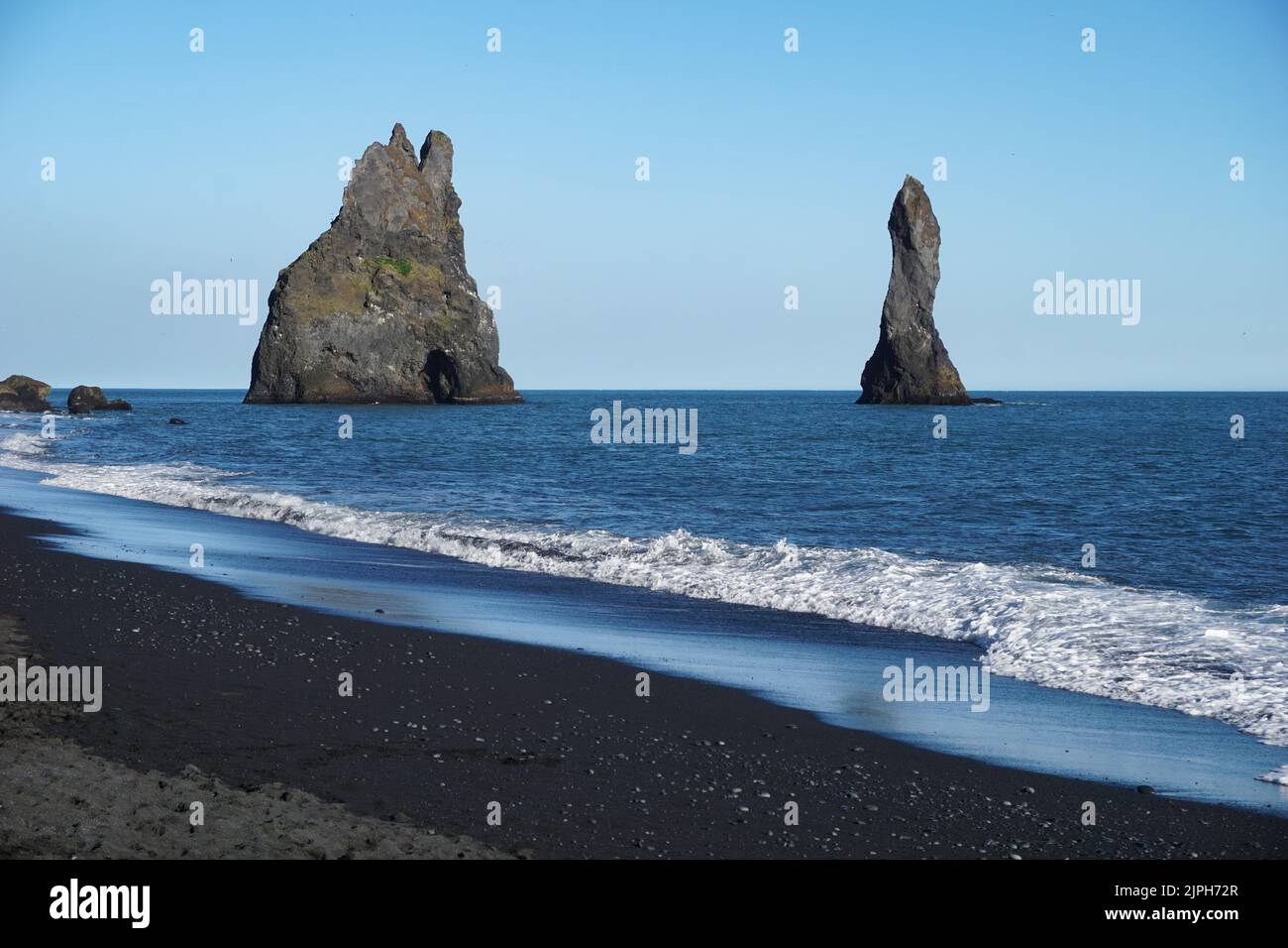 Two rocks at Reynisfjara Black Beach in Iceland Stock Photo - Alamy
