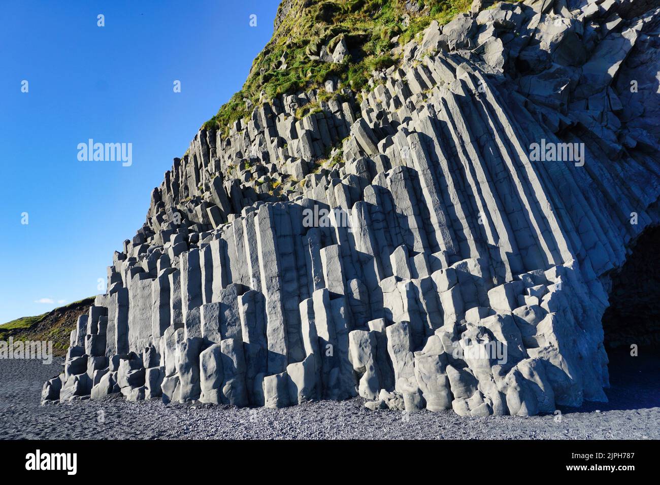 Basalt rocks and cave at Reynisfjara Black Beach in Iceland Stock Photo ...
