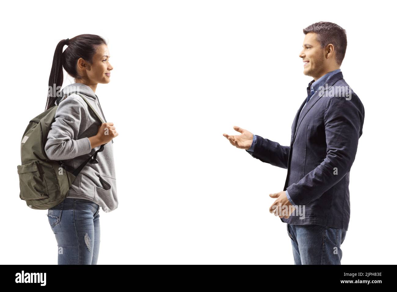 Profile shot of a female student and a young man talking isolated on ...