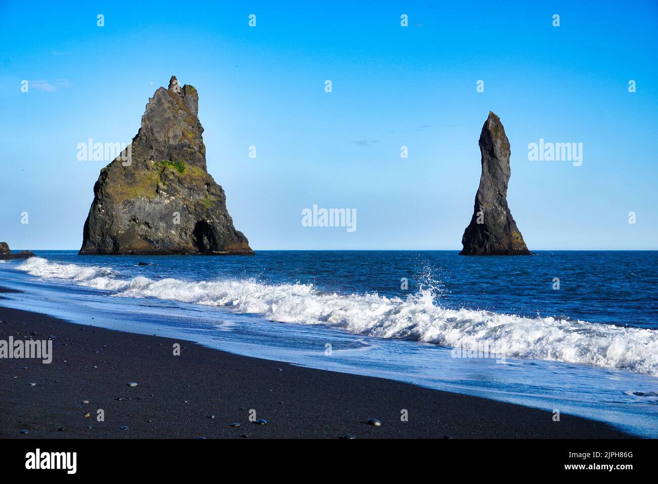 Two rocks at Reynisfjara Black Beach in Iceland Stock Photo - Alamy