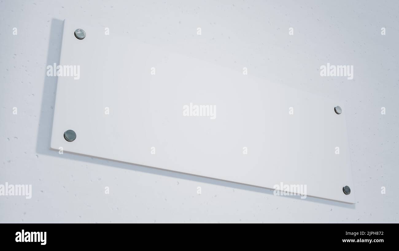 Low angle close-up view of blank rectangle nameplate mounted on clean ...