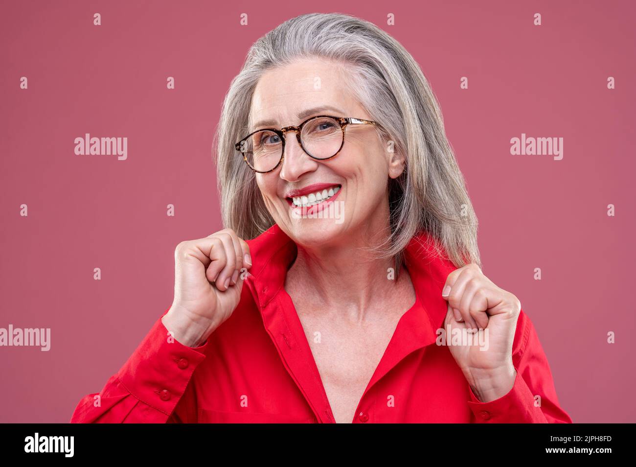 Mature woman in red shirt hi-res stock photography and images - Alamy