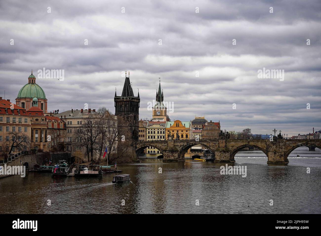 The Charles bridge, a medieval stone arch bridge that crosses the ...