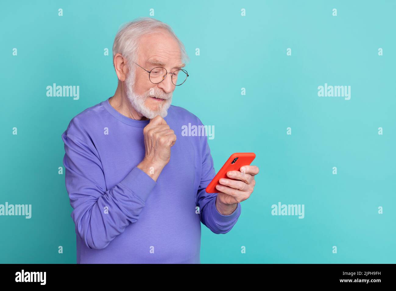 Photo of handsome minded person arm touch chin use telephone isolated ...